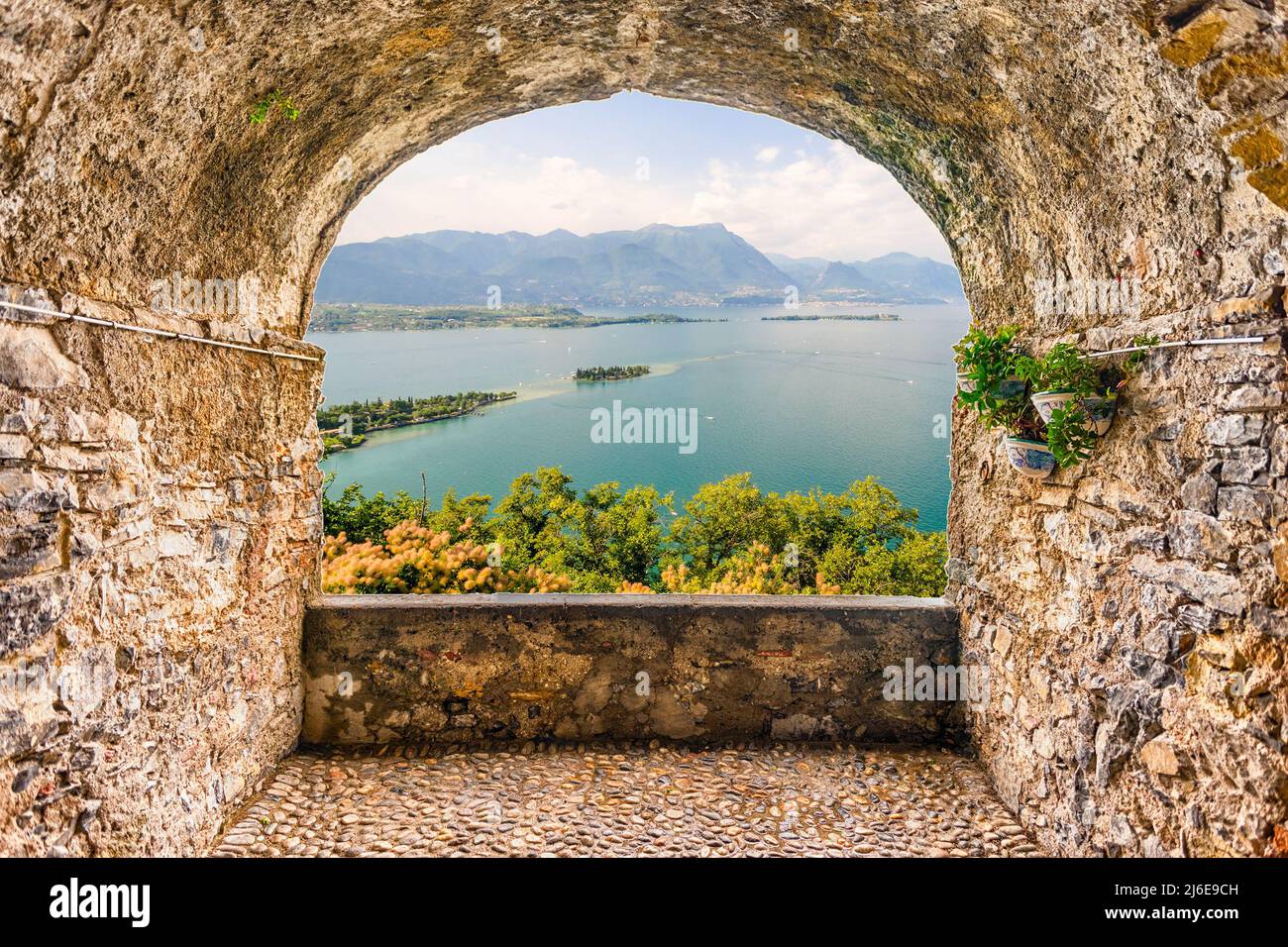 Scenic rock arch balcony overlooking the scenic Lake Garda, Italy Stock ...