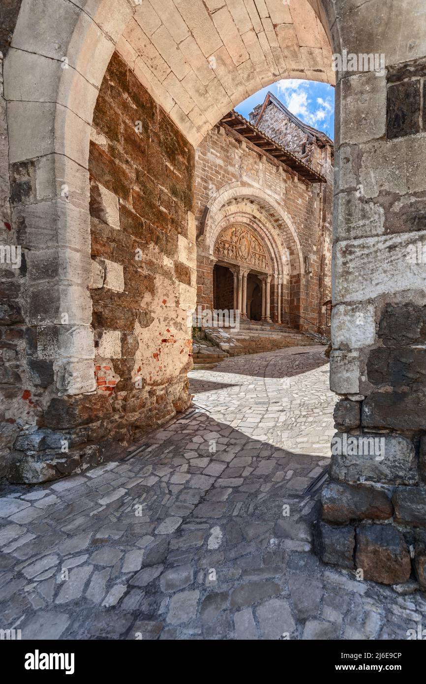 Cobblestone passage to church Eglise Saint-Pierre de Carennac ...