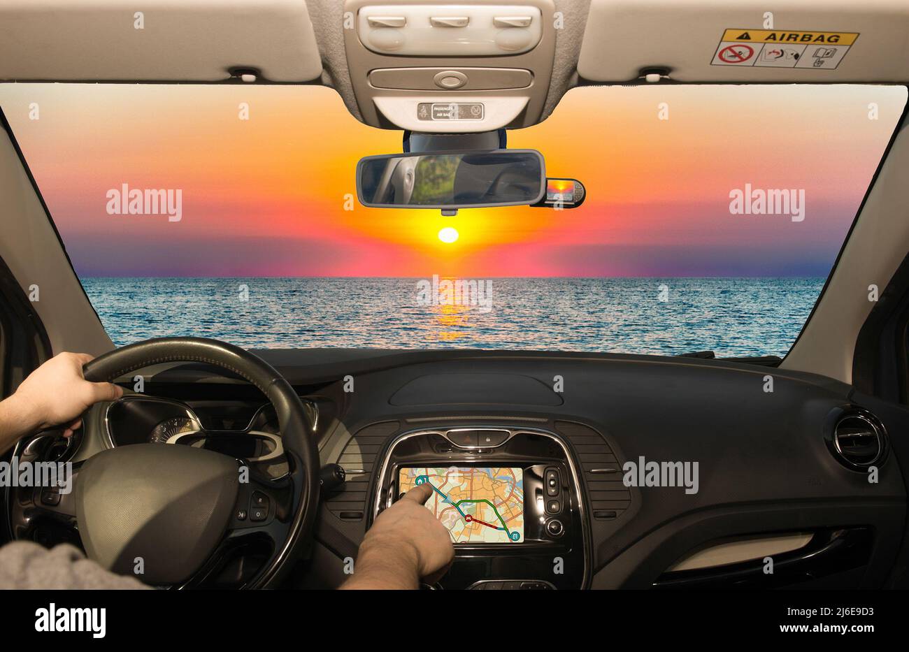 Driving a car while using the touch screen of a GPS navigation system a ...