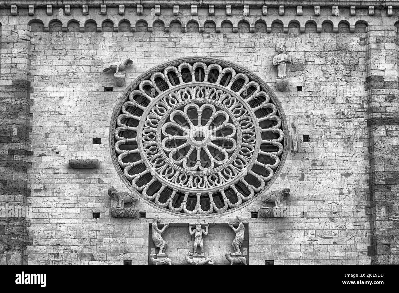 Rose window on the facade of the medieval Cathedral of Assisi, Italy ...