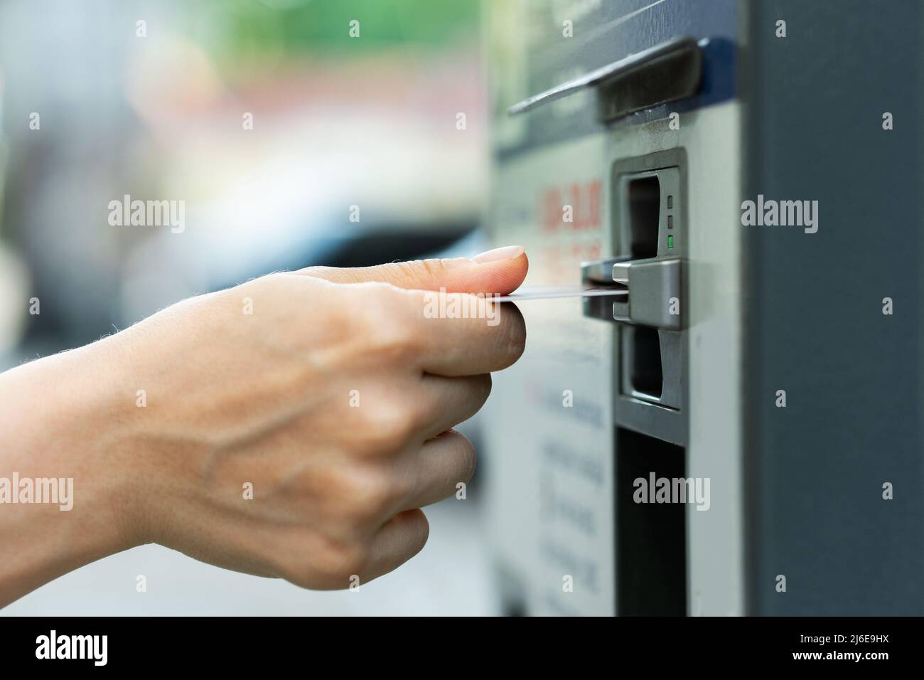 Female hand with a credit card and ticket vending machine Stock Photo ...