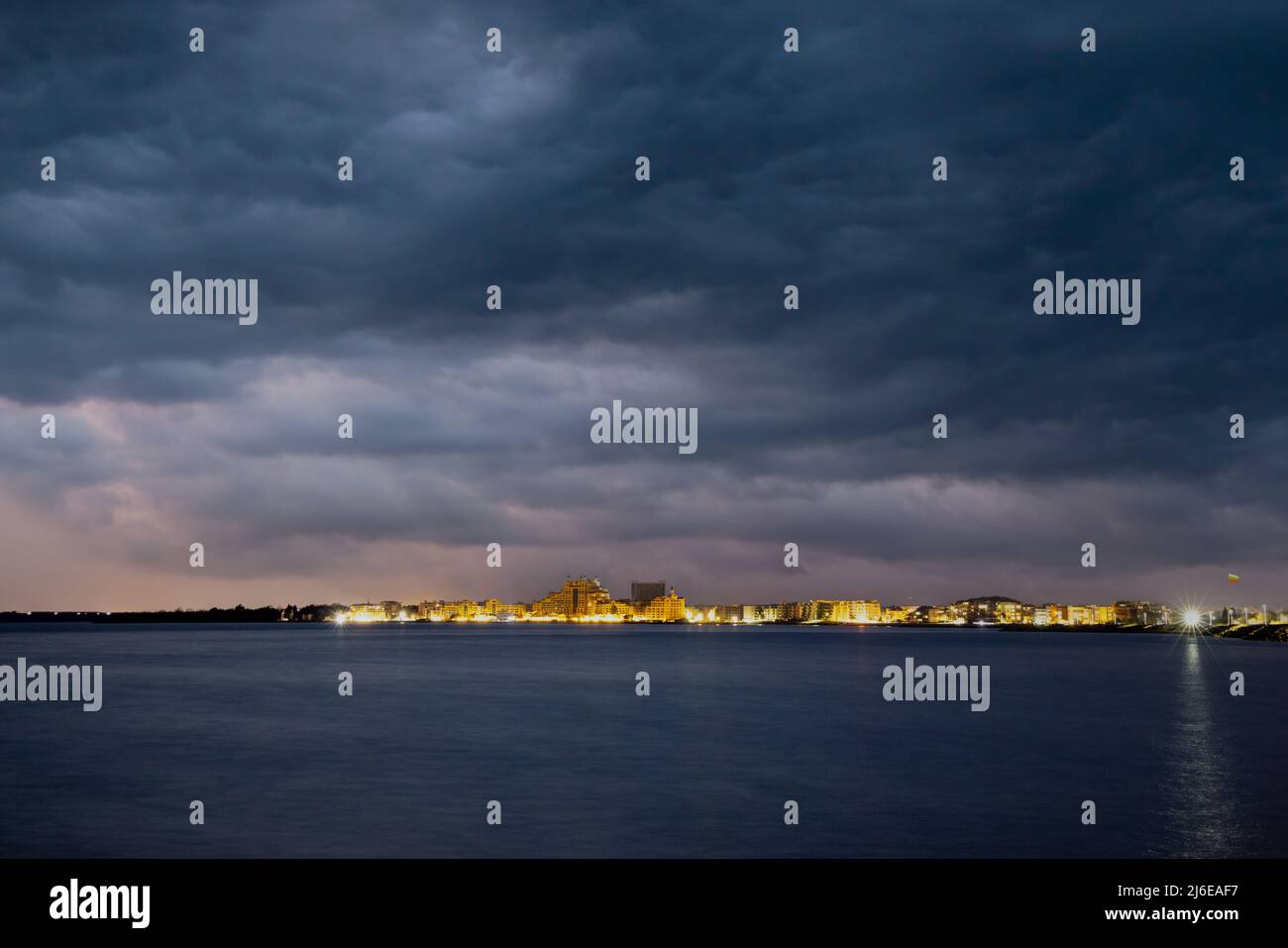 View of a beautiful bright night city with small flickering electric ...