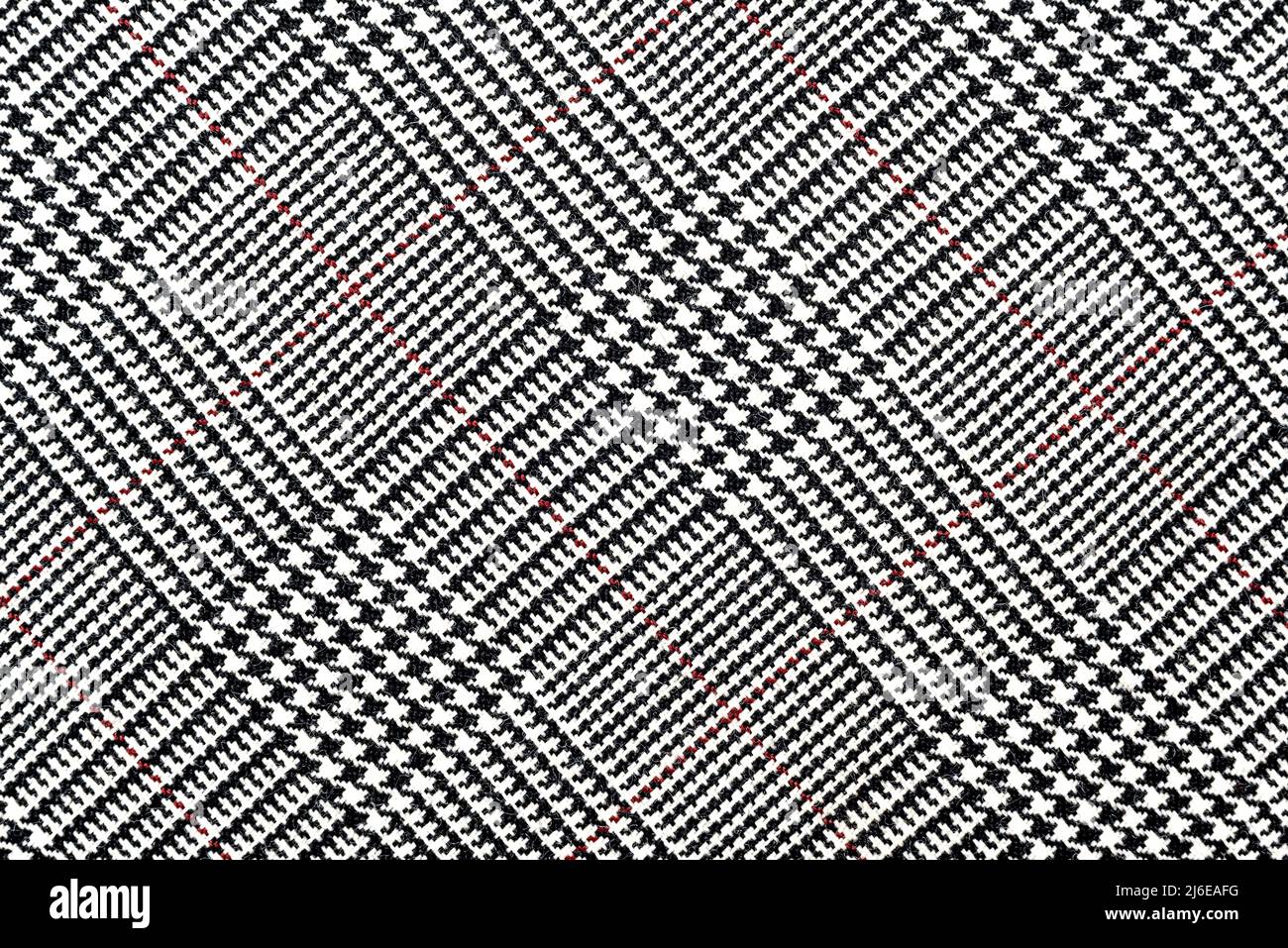 Background from fabric in a cage. A piece of checkered fabric close-up ...