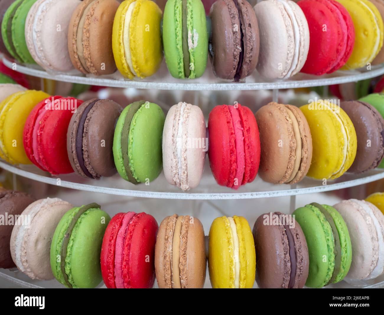 Colorful homemade macarons, dessert on round shelf, close-up. Different ...