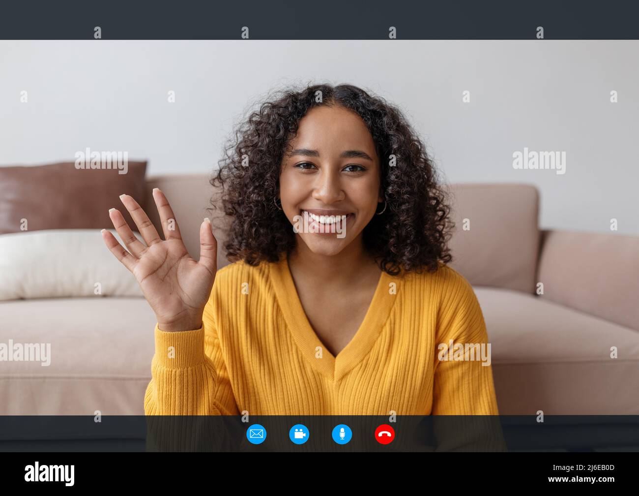 Head shot of happy young black woman waving at webcam, greeting friend ...