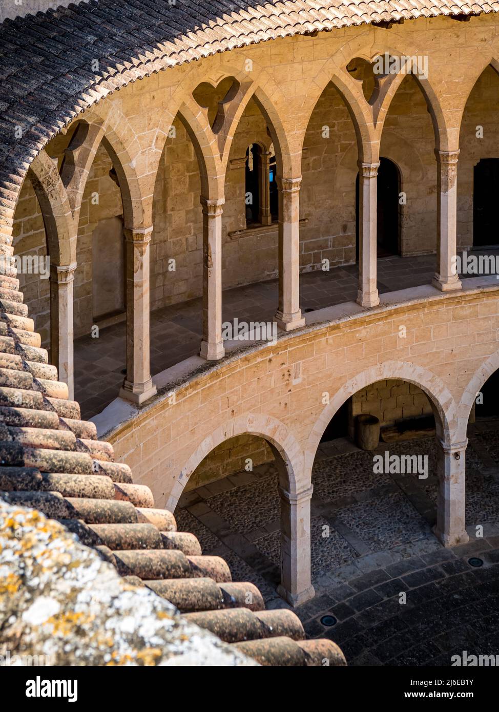 Photography of Romanesque style colonnade in the ground floor and ...