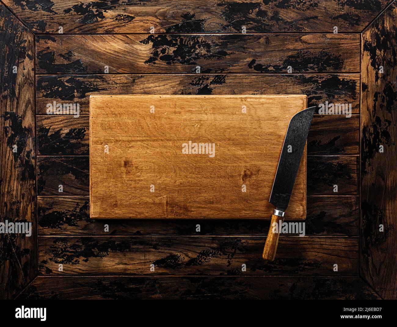 Butcher. Vintage meat knife on cutting board over wooden table Stock ...