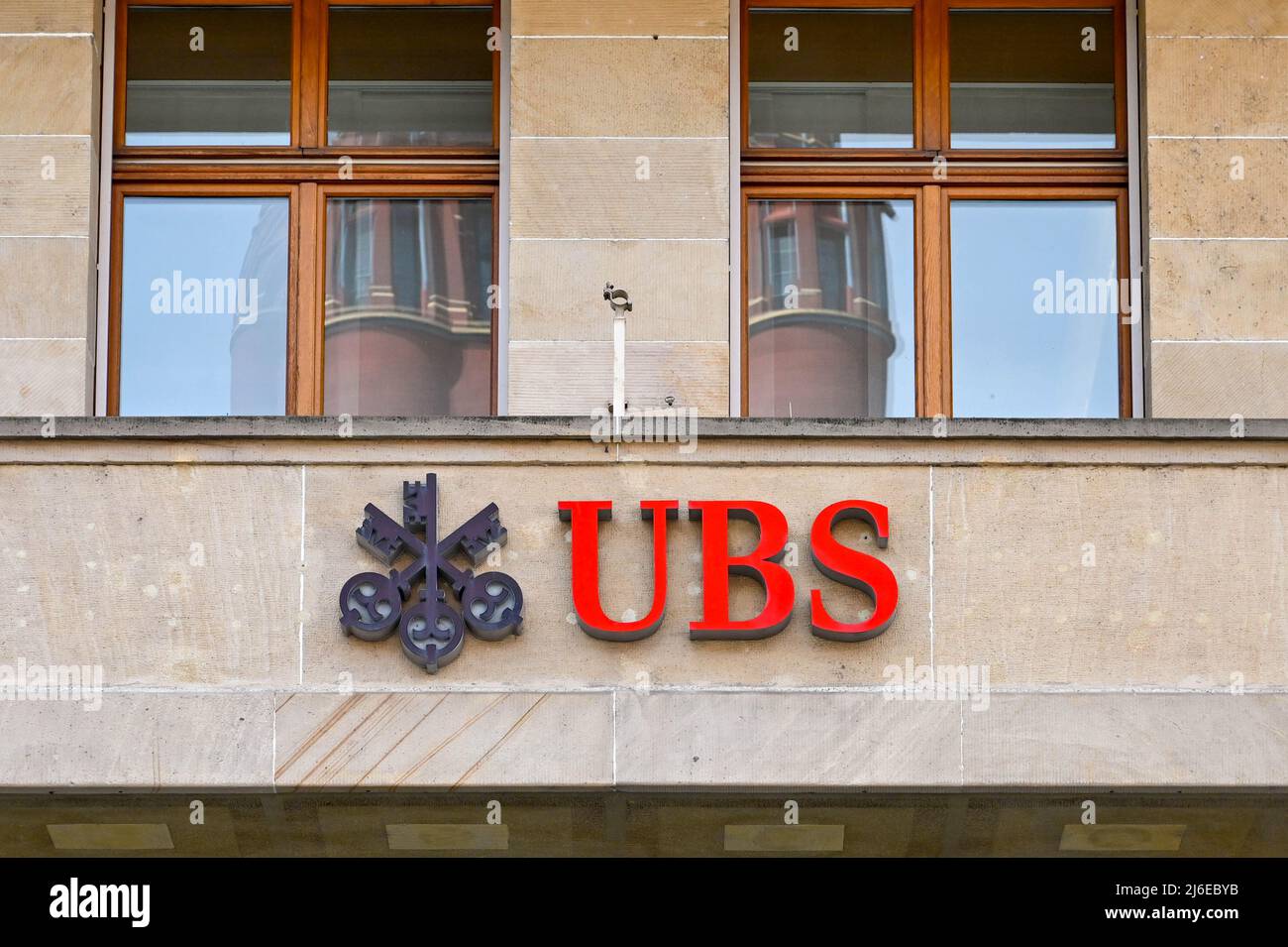 Basel, Switzerland - April 2022: Sign above the entrance to a branch of ...