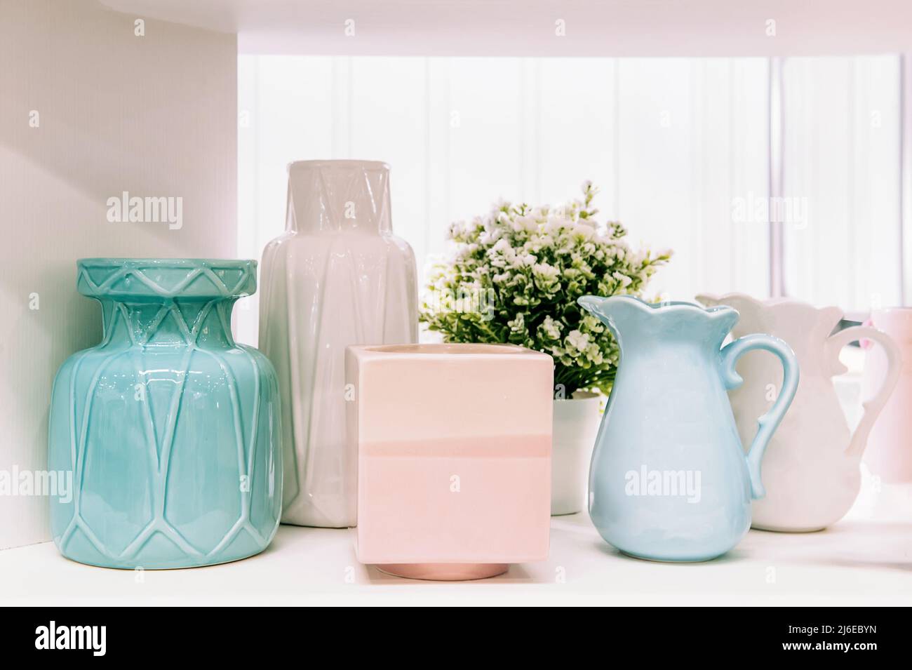 front view of various ceramic vases ceramic concept. Shelves with ...