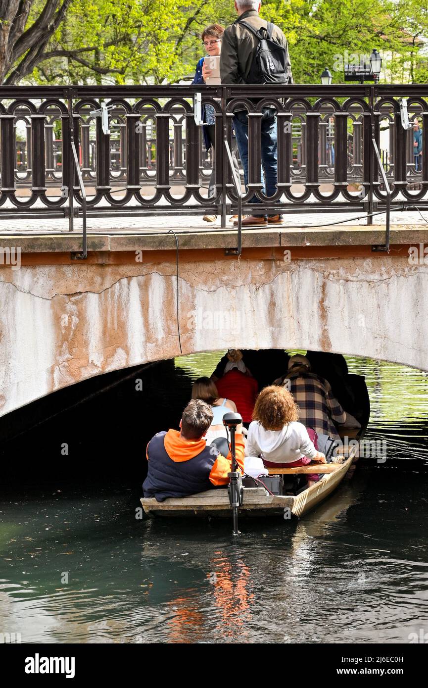 Colmar, France - April 2022: Tourists in a boat on the canal which runs ...