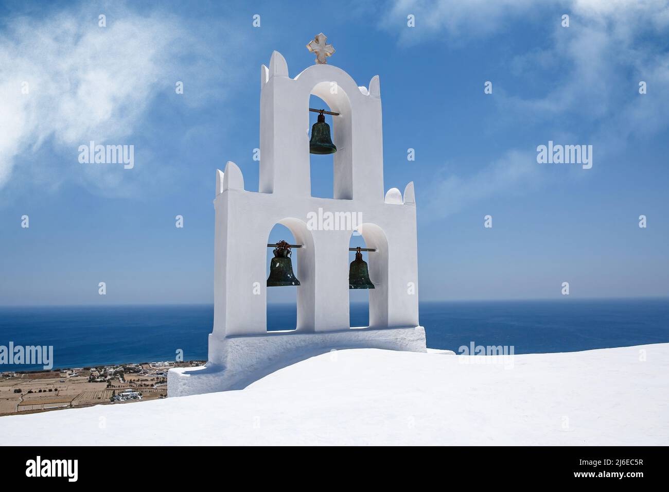 Bell tower of the traditional Greek tower on blue sea background Stock ...
