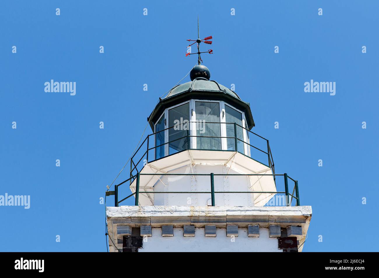 The head of lighthouse on a blue sky background Stock Photo - Alamy