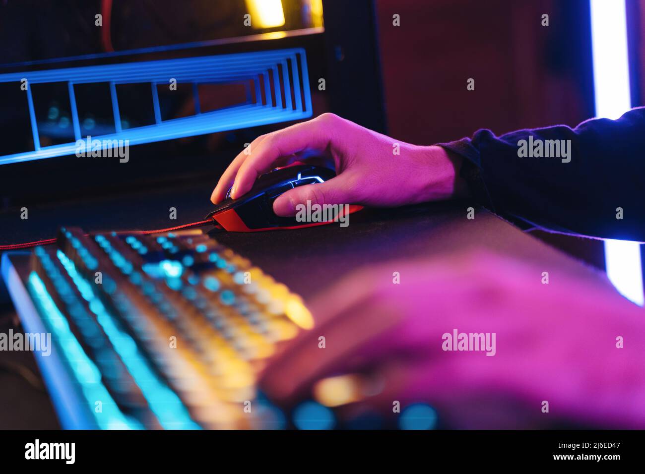 Close up of man gamer's hands using professional computer mouse and ...