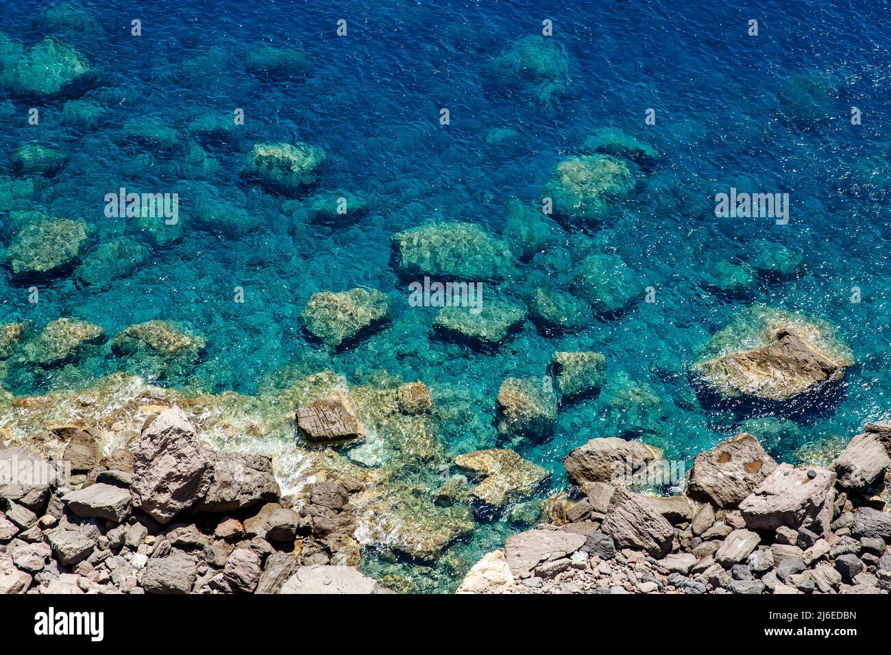 Stones at the bottom of the blue ocean Stock Photo - Alamy