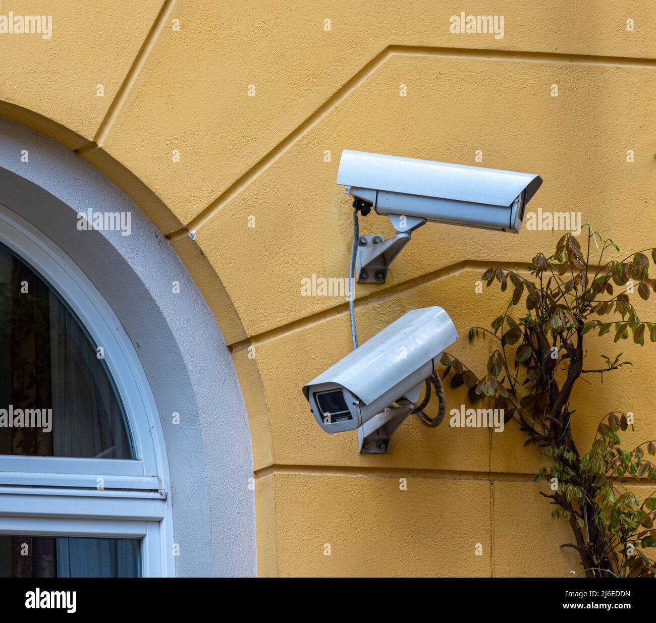 security camera or surveillance system on a house wall Stock Photo - Alamy