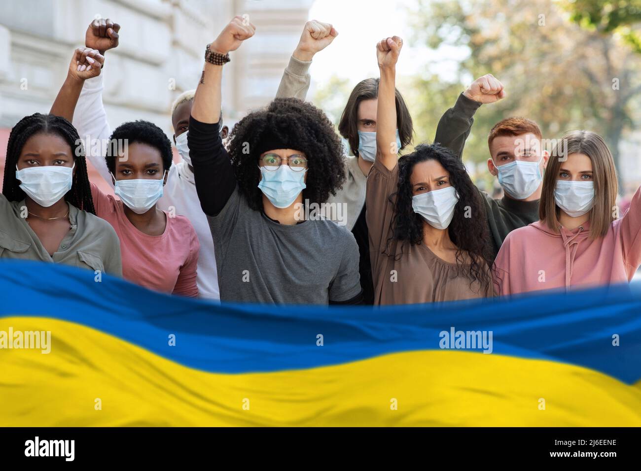 Group of people wearing face mask protesting against war Stock Photo ...