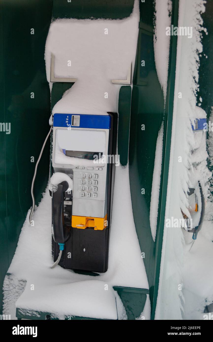 Street phone booth covered with snow after strong storm Stock Photo - Alamy