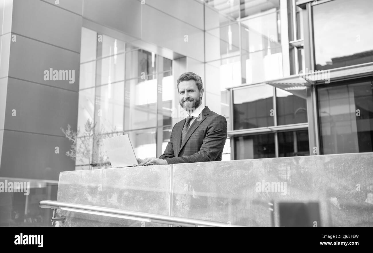 happy entrepreneur. agile business. professional network administrator hold computer Stock Photo ...