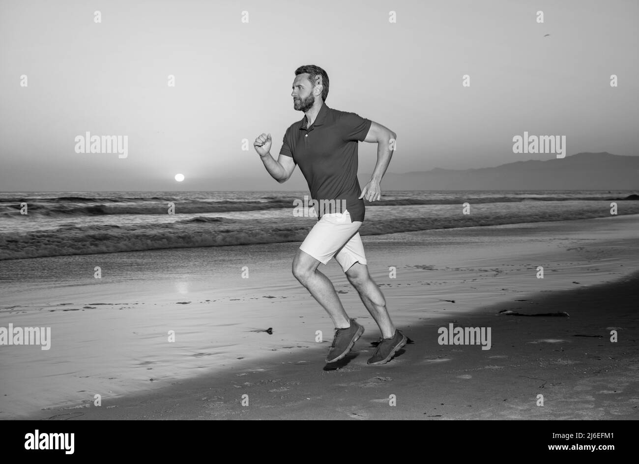 jogger. sport athlete run fast to win in sea sunset. morning workout ...