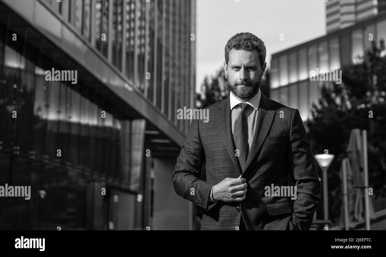 successful man in businesslike suit. manager executive outside the ...