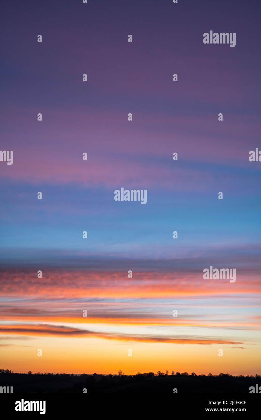 Colourful early morning dawn clouds before sunrise in spring ...