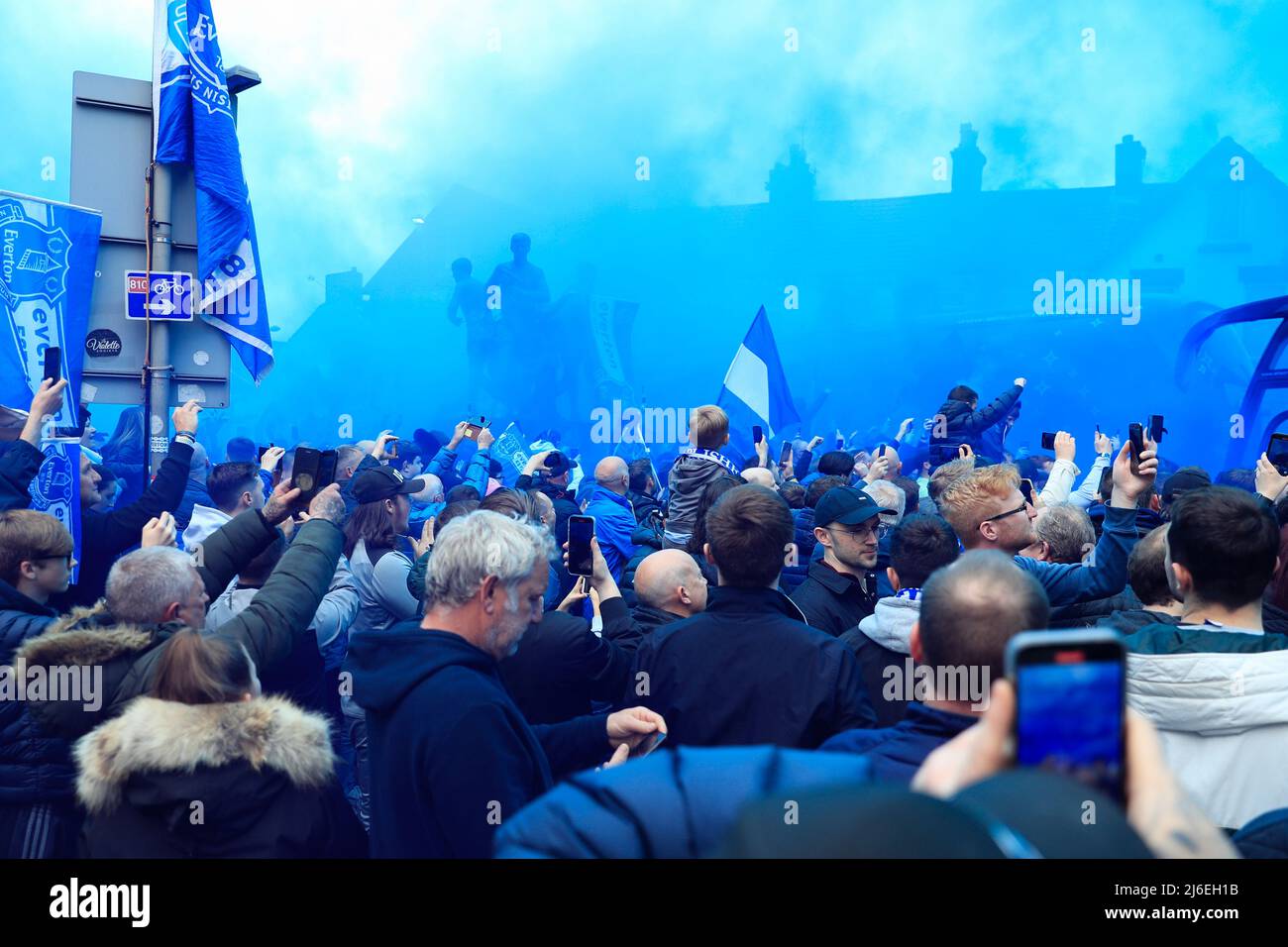 The Everton team bus arrives as fans let off blue flares Stock Photo ...