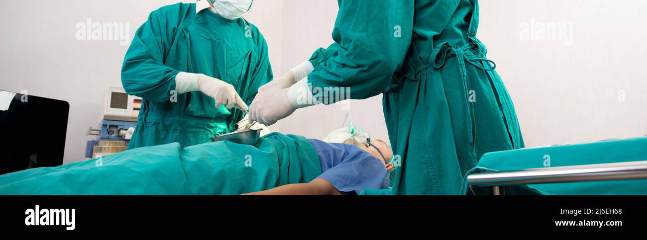 Group of team doctor and surgeon doing surgery with patient in the ...