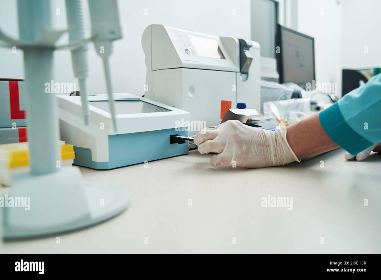 Woman researching blood tests with modern equipment Stock Photo - Alamy