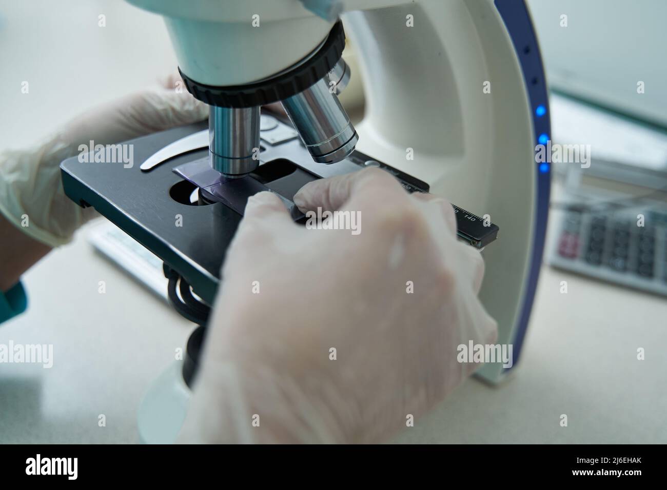 Doctor doing blood test microscope hi-res stock photography and images ...