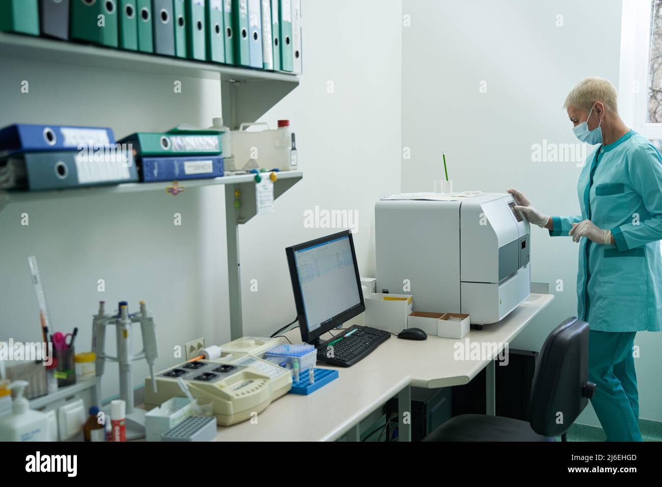 Female laborant doing medical research with modern equipment Stock ...