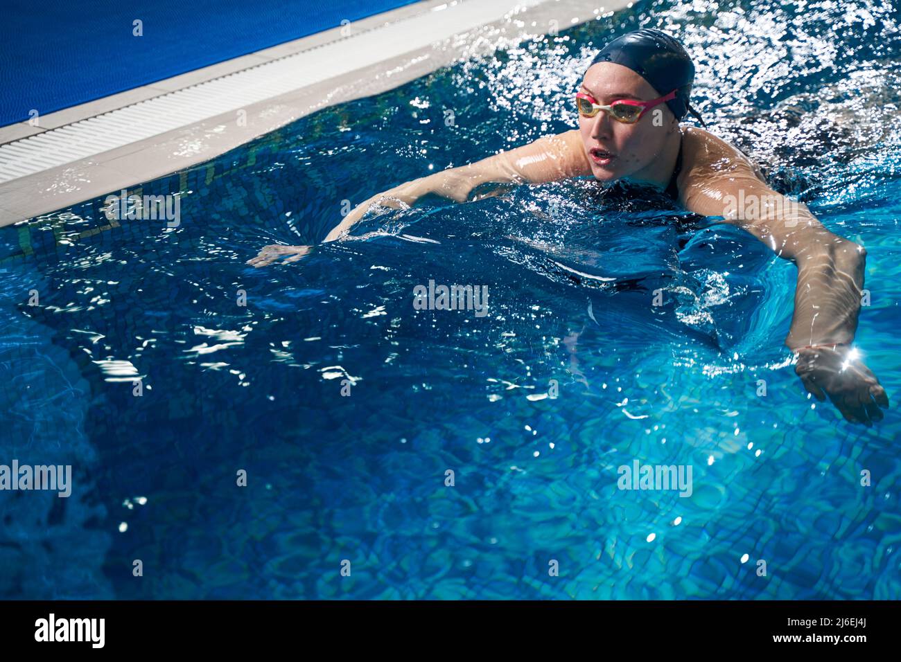 Athletic lady improving her skills in the swimming pool Stock Photo - Alamy