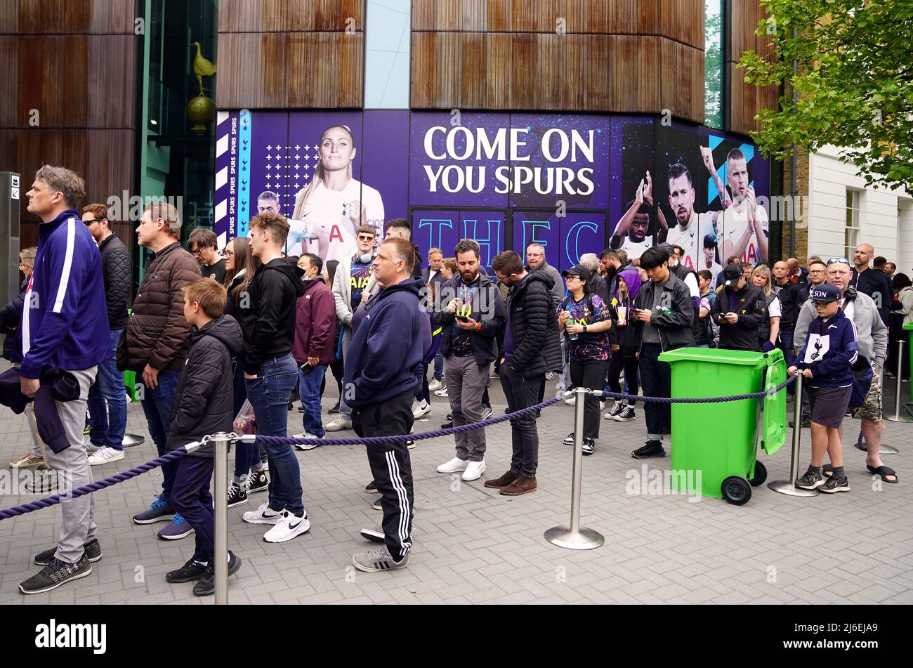 Tottenham Hotspur fans queue for entry to the stadium ahead of the ...