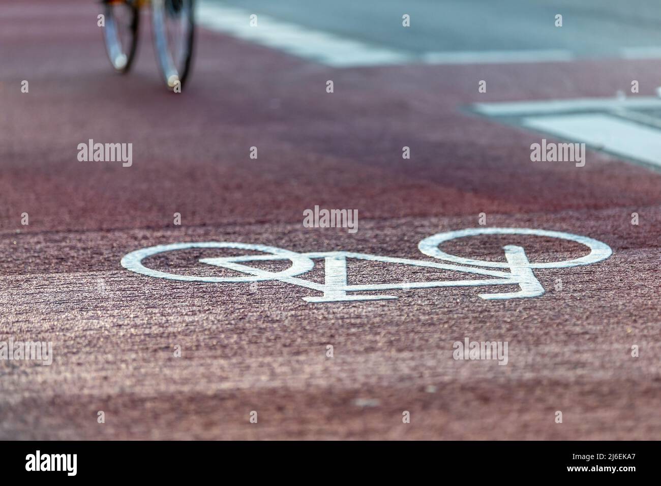 bike path icon on red coating Stock Photo - Alamy