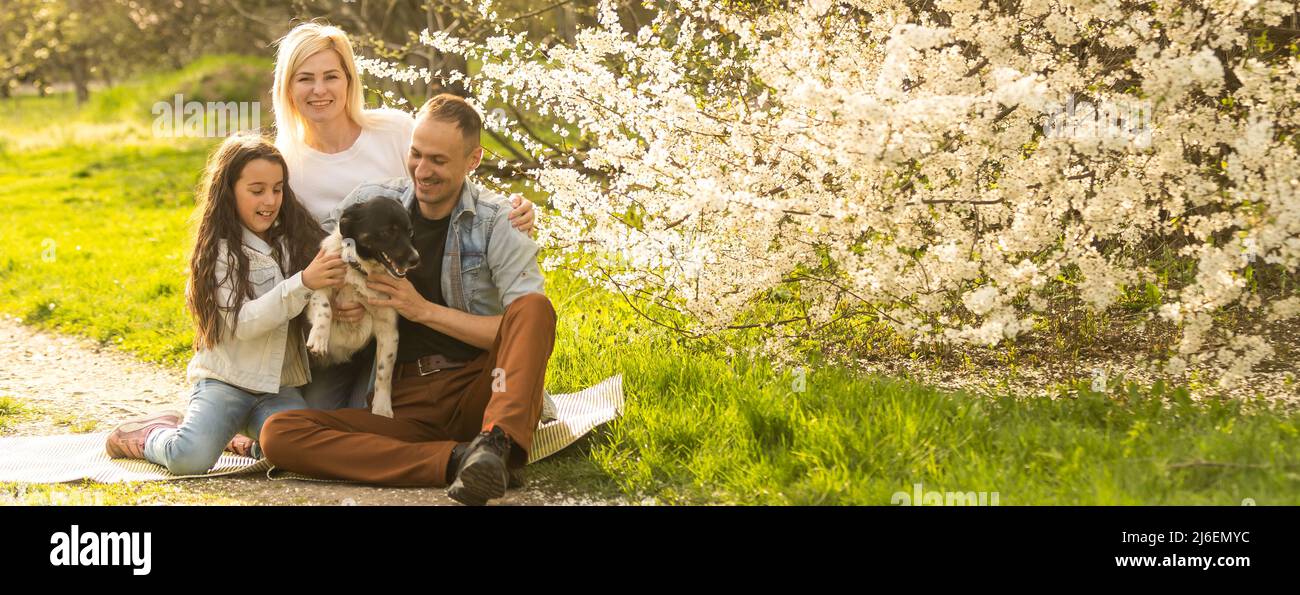 Family and child outdoors in spring nature, resting Stock Photo - Alamy
