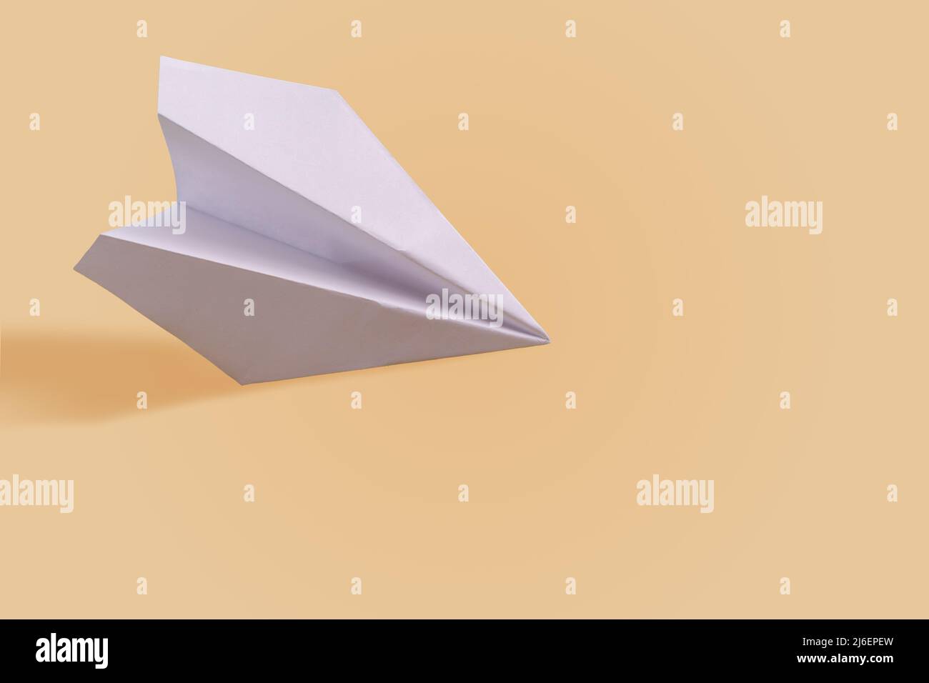 Paper airplane on a tone-harmonious background, toned Stock Photo - Alamy