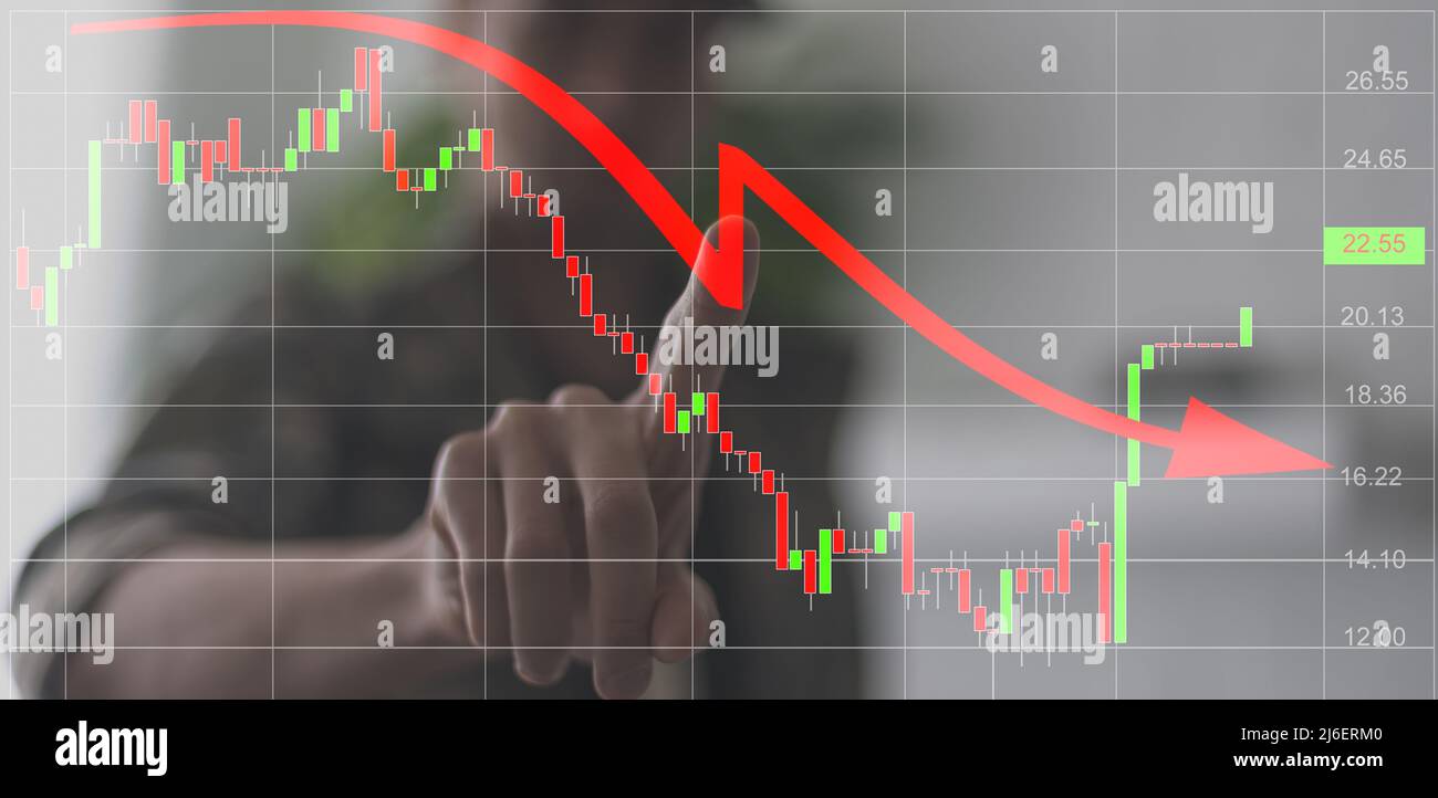 Businessman with chart in the fall, economy going down Stock Photo - Alamy