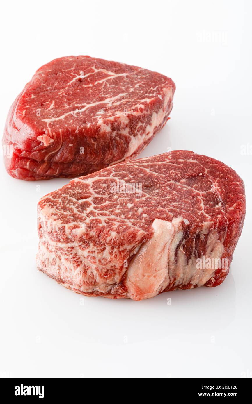Raw beef filet mignon steak on white. Red angus meat Stock Photo - Alamy