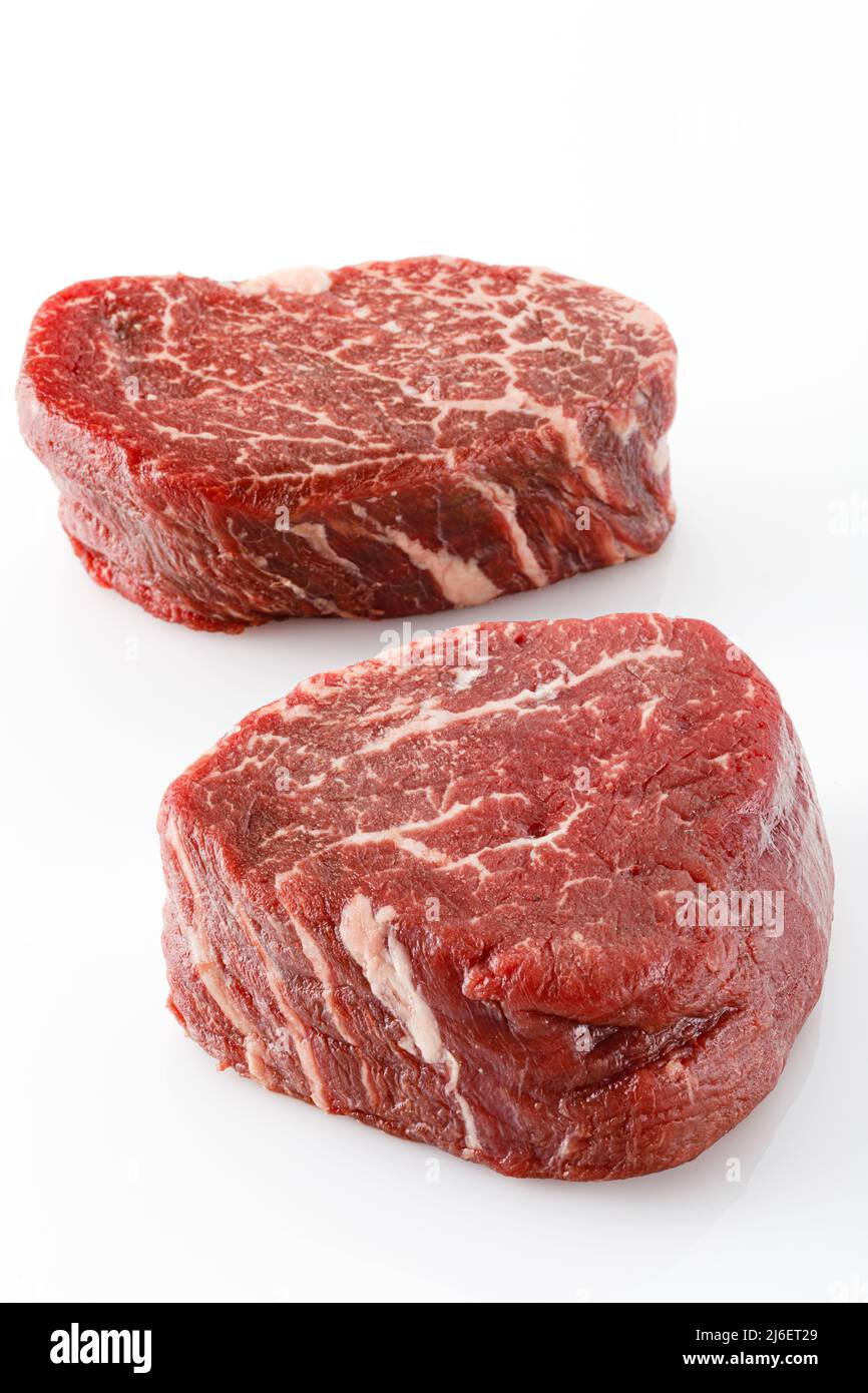 Raw meat. Close-up view of filet mignon isolated on white background ...
