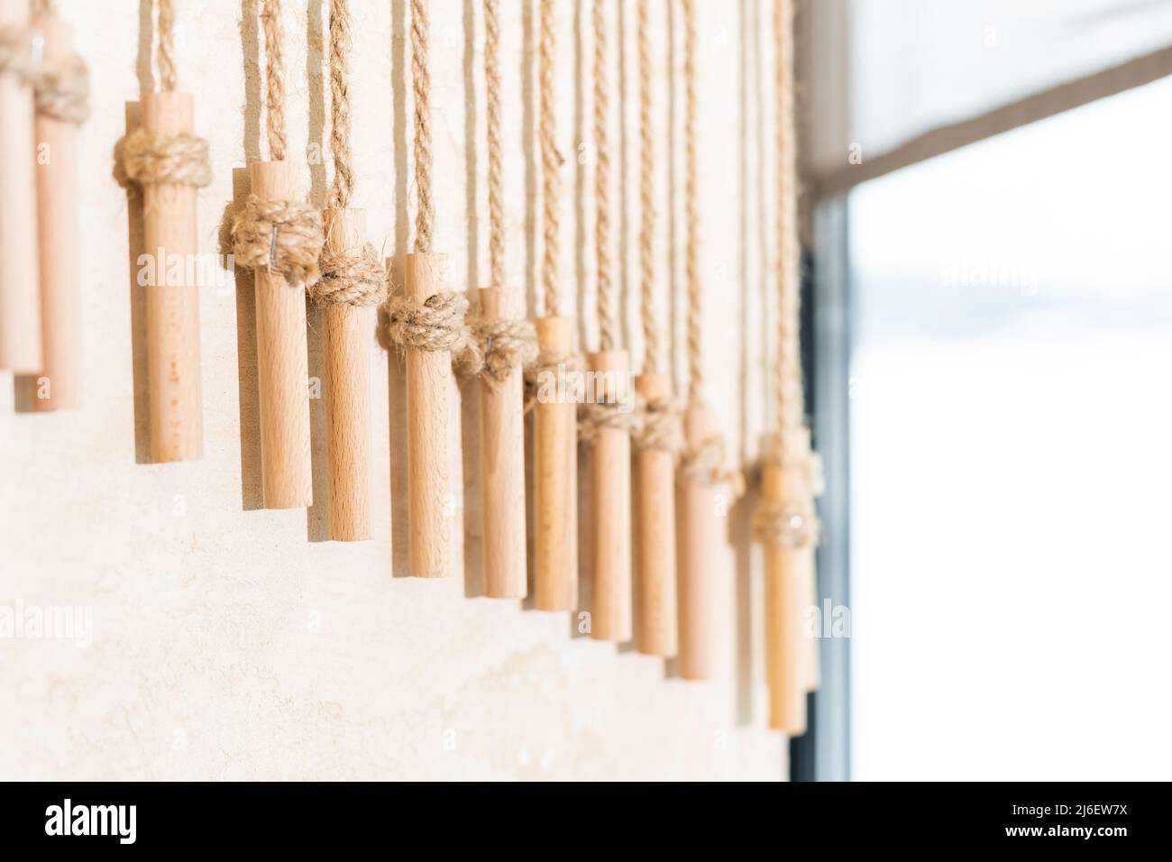 wooden handles hang on a rope, decor Stock Photo - Alamy