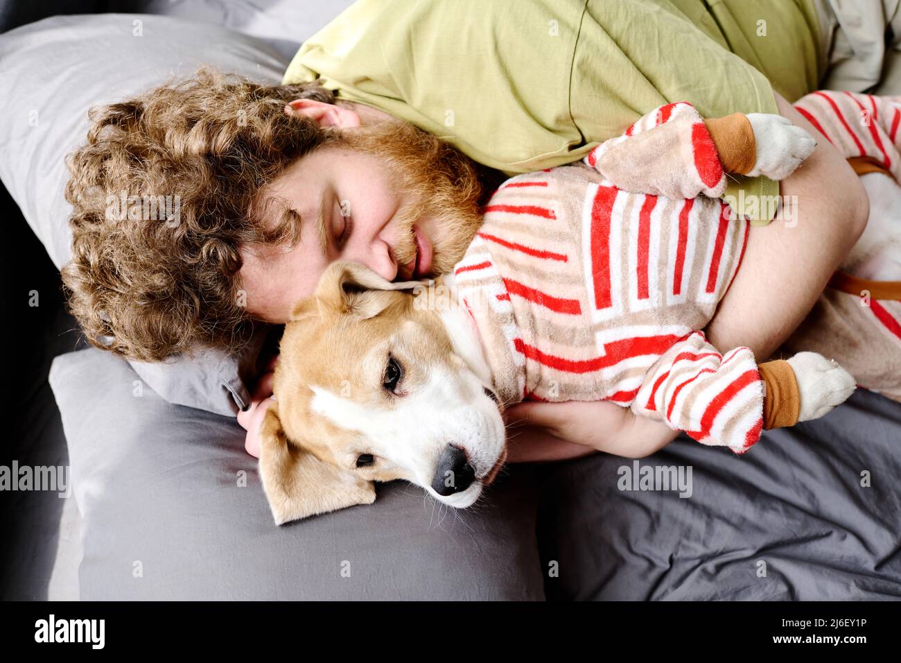 Man sleep with dog hi-res stock photography and images - Alamy