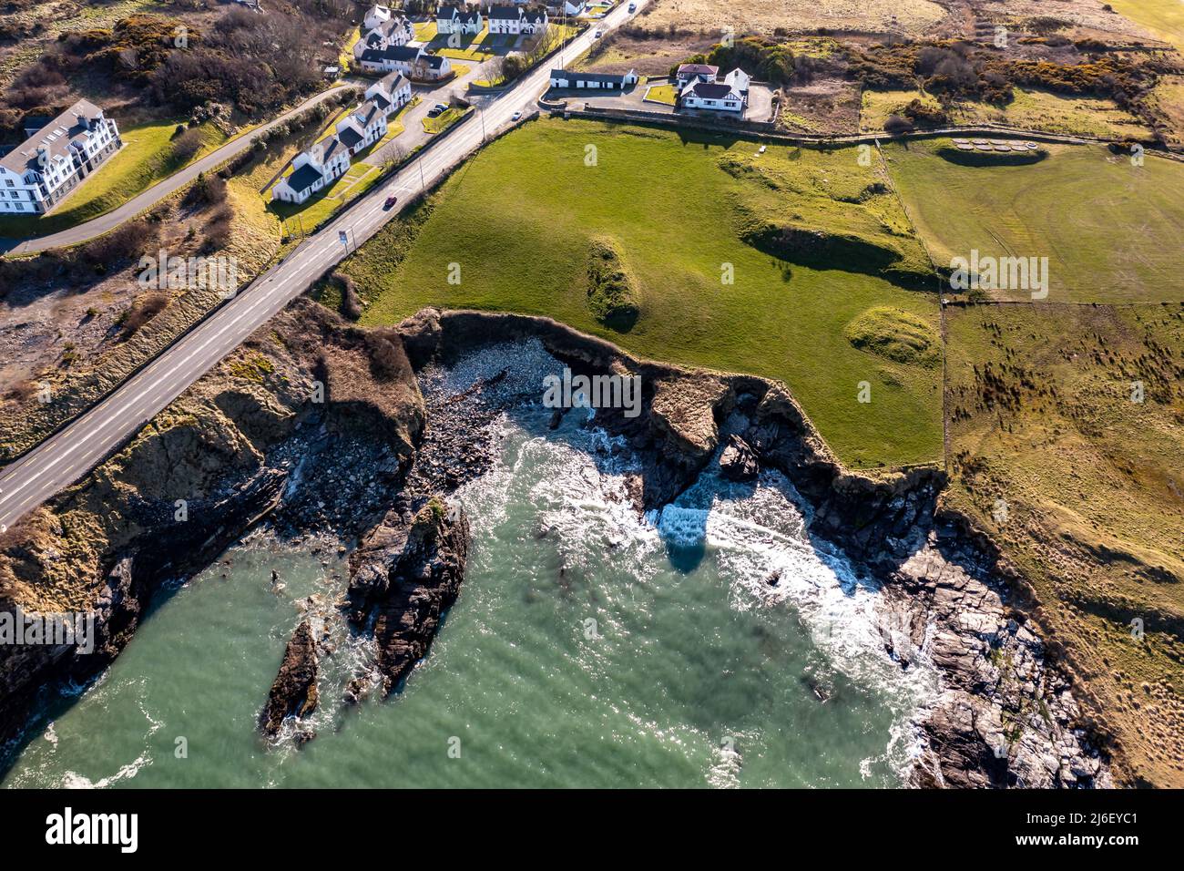 Aerial view of the sunny rocky coast of Portnablagh, Co. Donegal ...