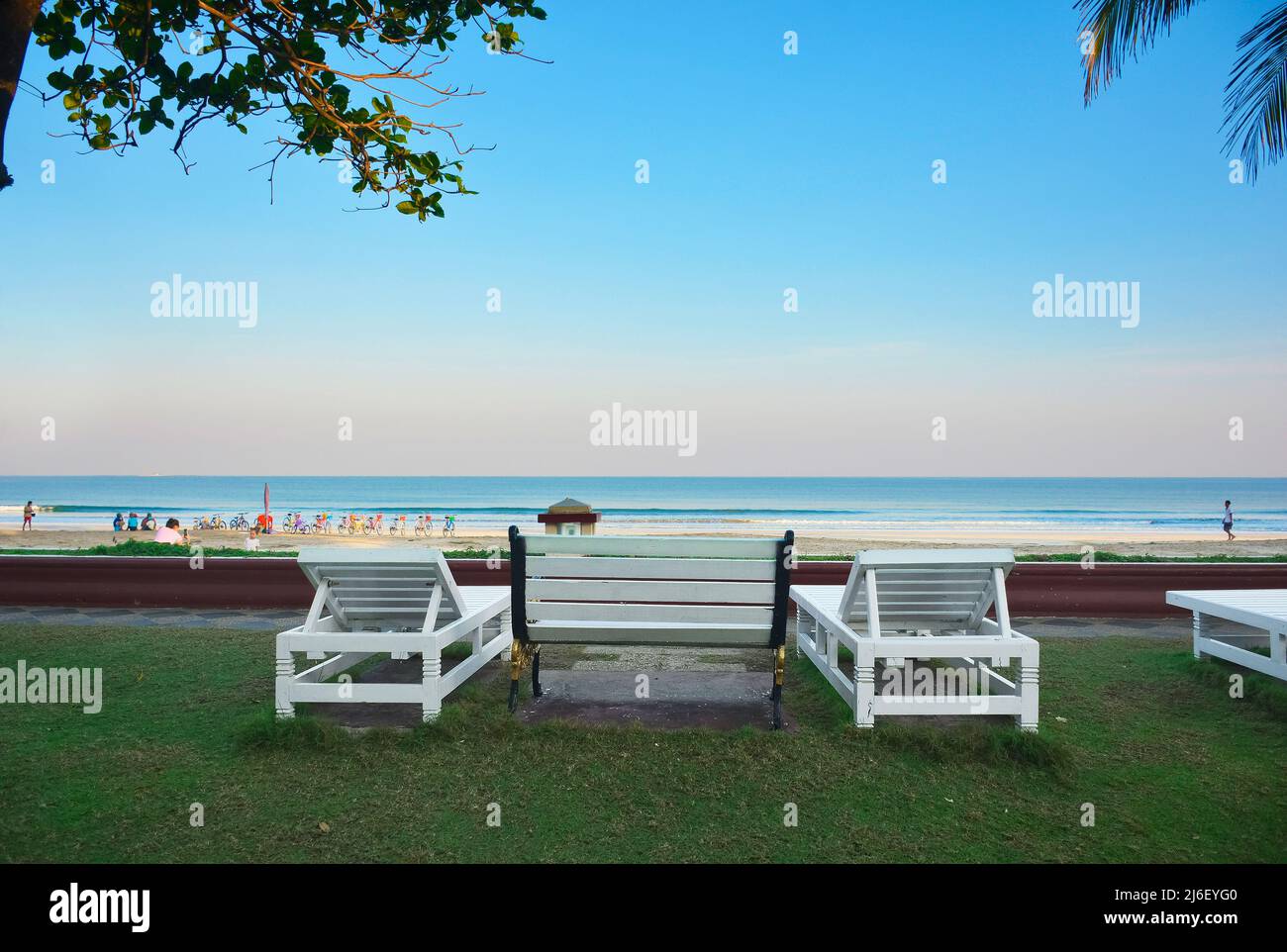 Relaxing benches on Chaung Thar beach, Myanmar Stock Photo - Alamy