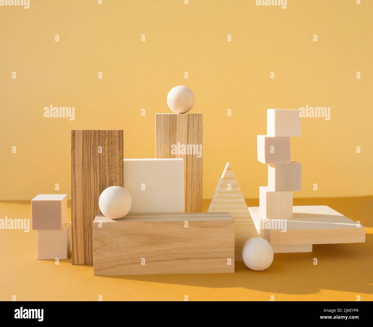 Geometric composition with many three-dimensional wooden figures ...