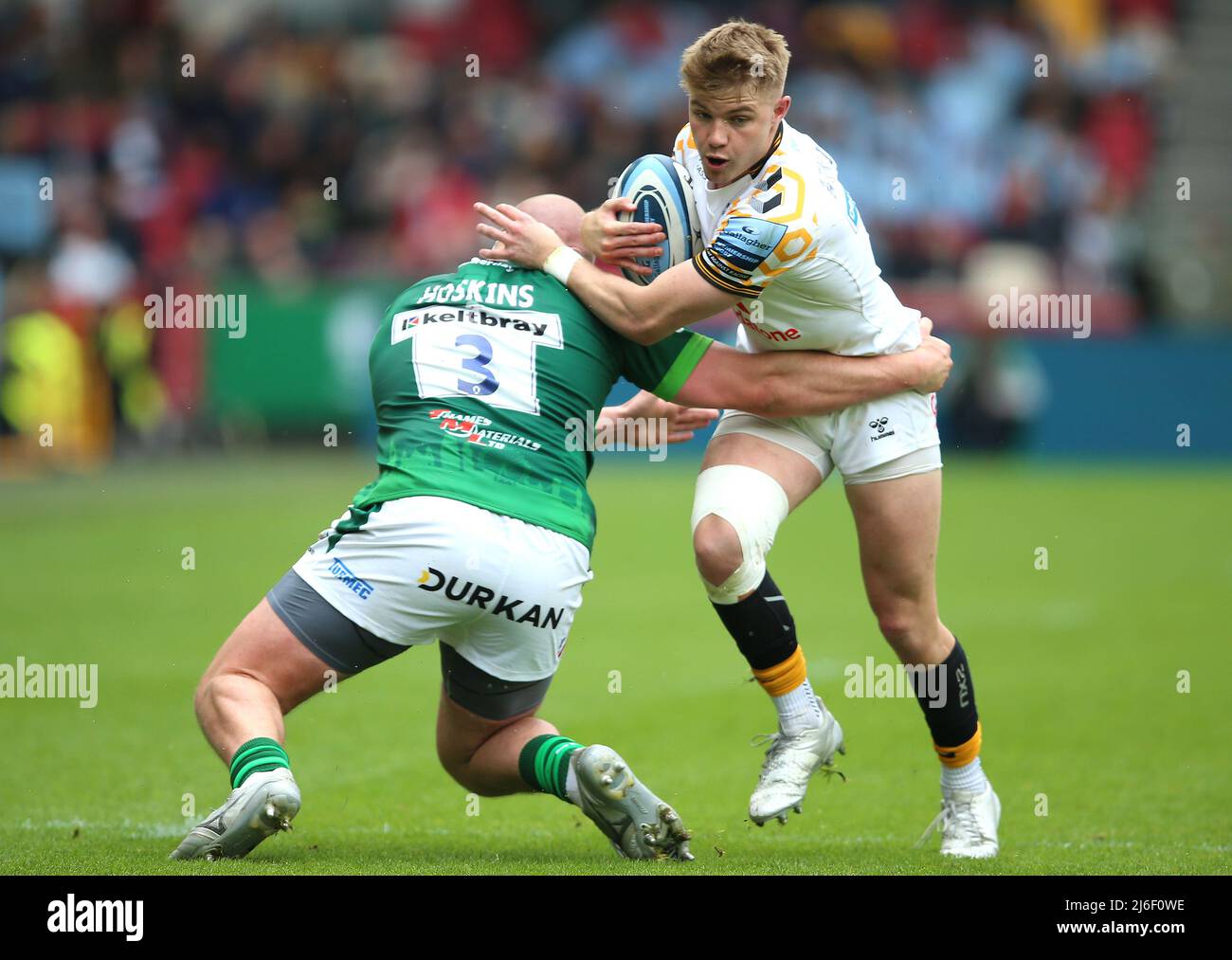 London Irish’s Ollie Hoskins tackles Wasps’ Charlie Atkinson during the ...
