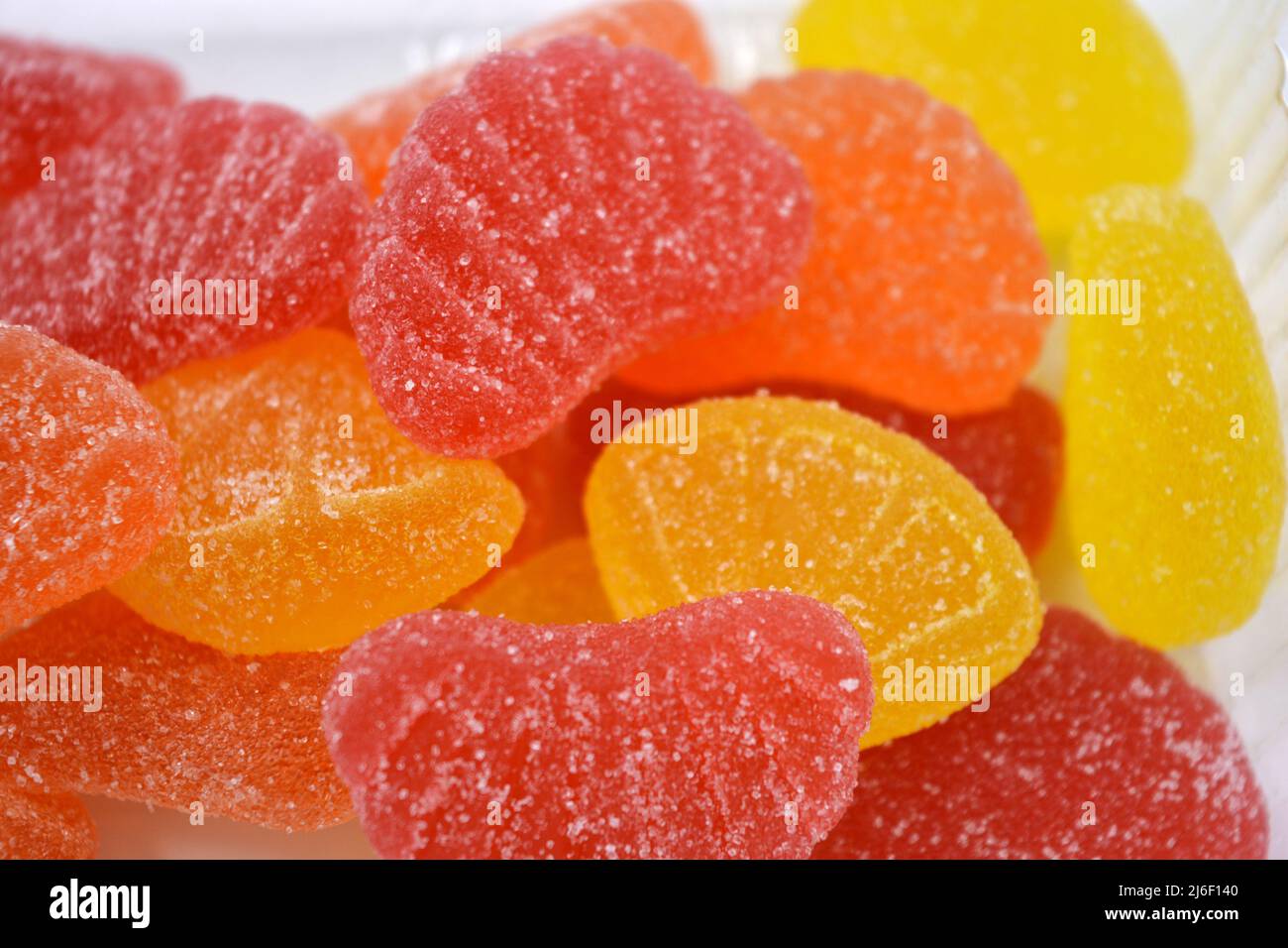 Bright, sweet, delicious yellow, orange, red, pink jelly candies ...