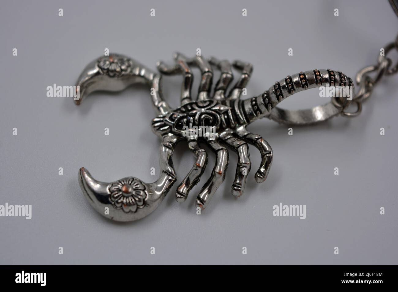 Large silver, metallic, militant figure of a scorpion located on a ...