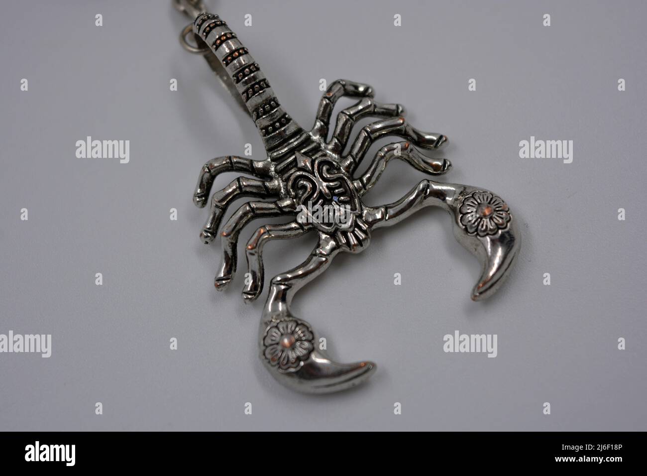Large silver, metallic, militant figure of a scorpion located on a ...