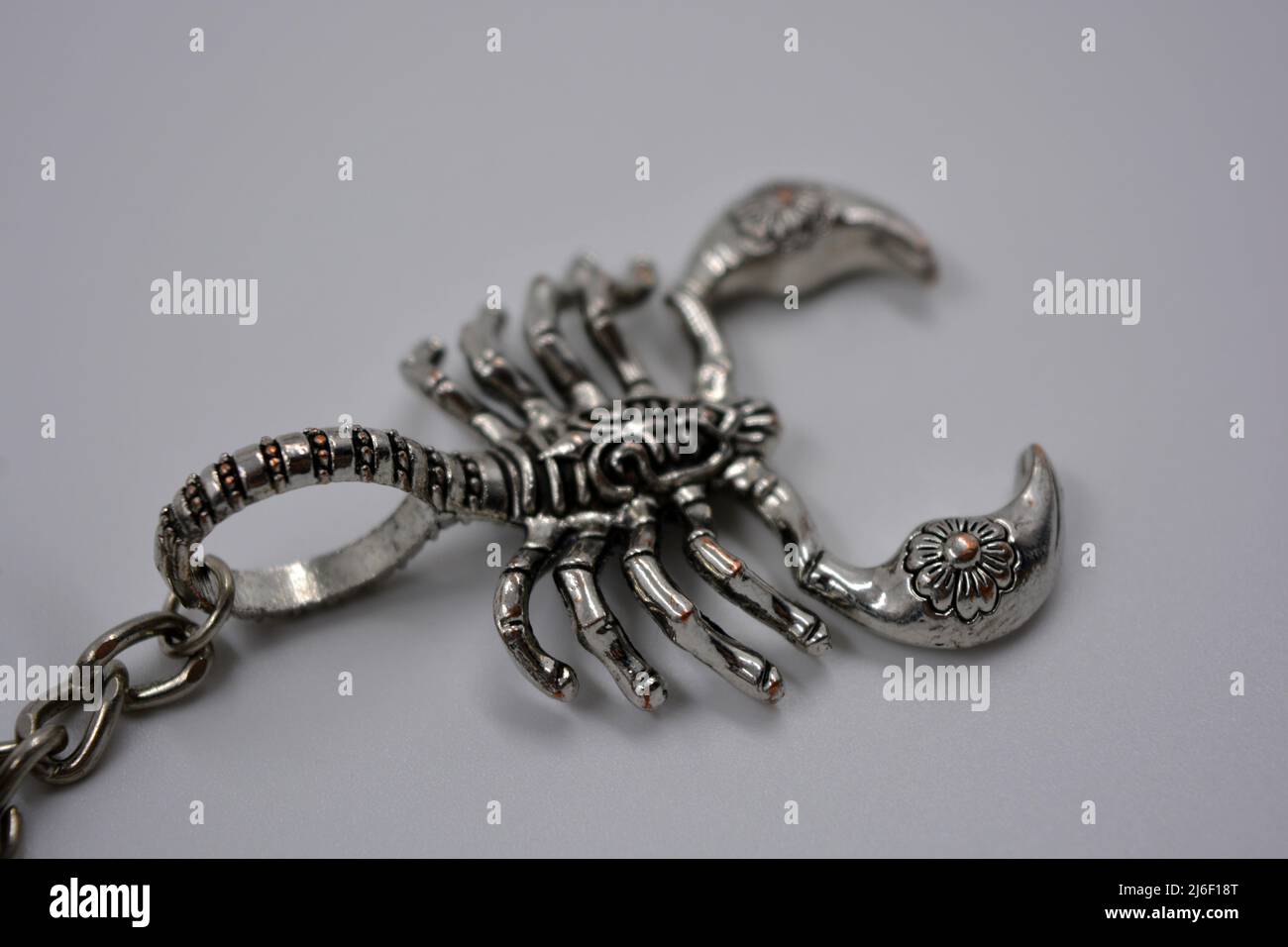 Large silver, metallic, militant figure of a scorpion located on a ...