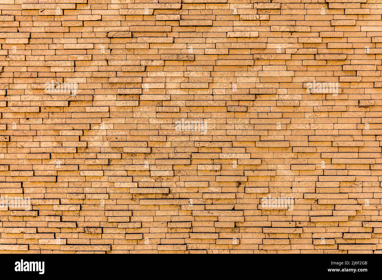 Yellow brick wall. Background of rectangular gray tiles of different ...