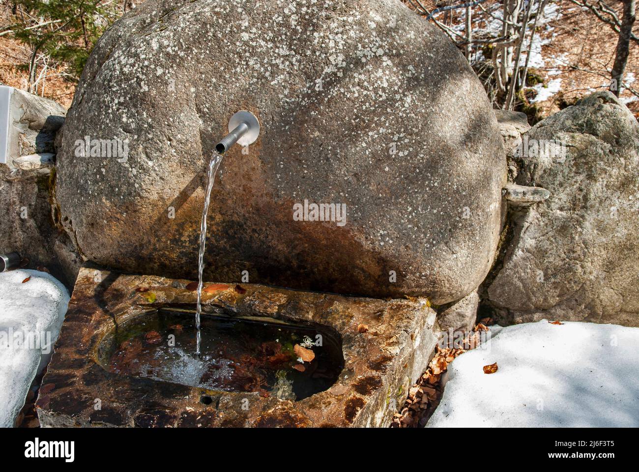 Stone mountain fountain with clear pure water running coming from ...